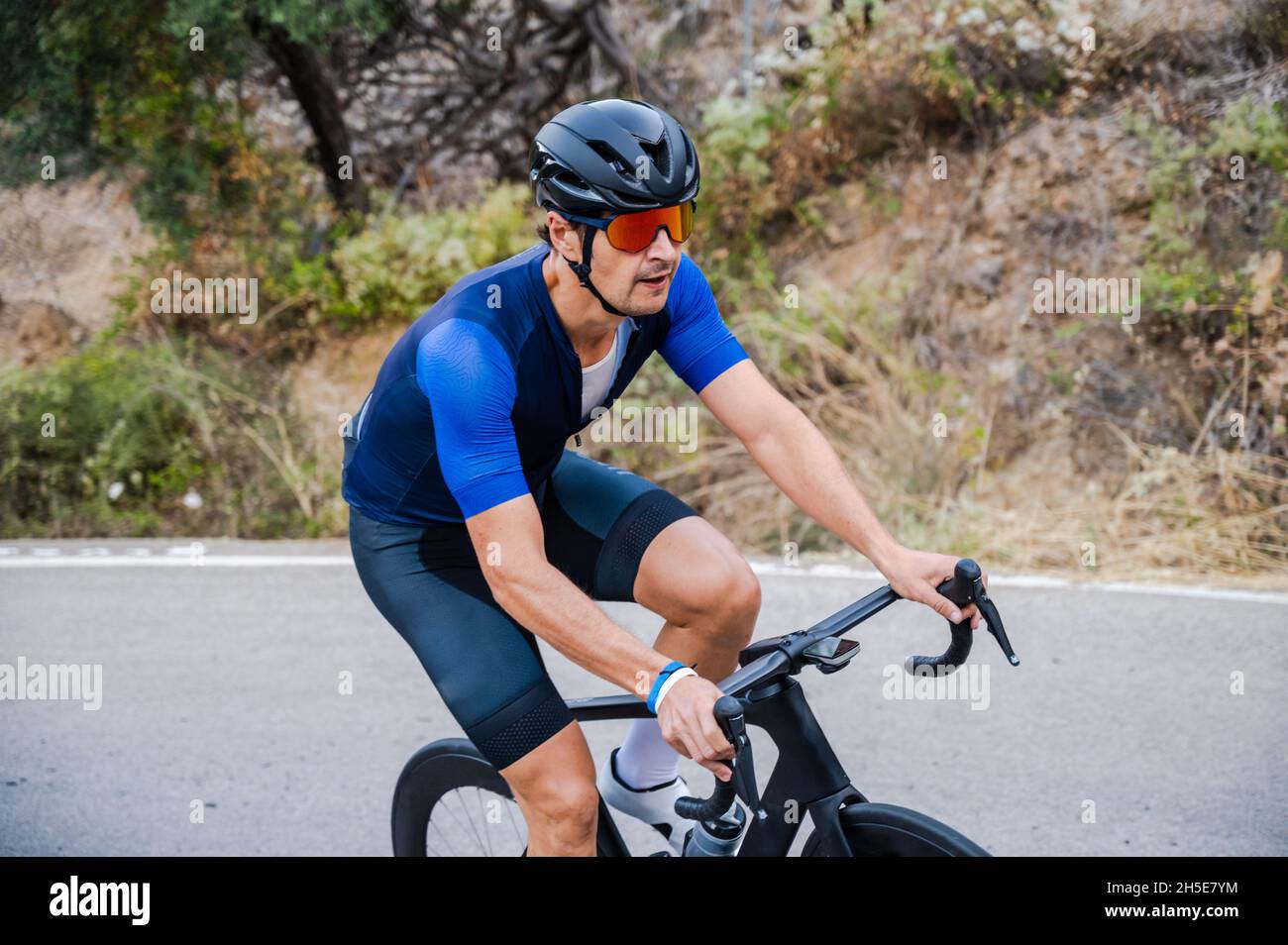 Cyclist riding bike fast pass hi-res stock photography and images - Alamy