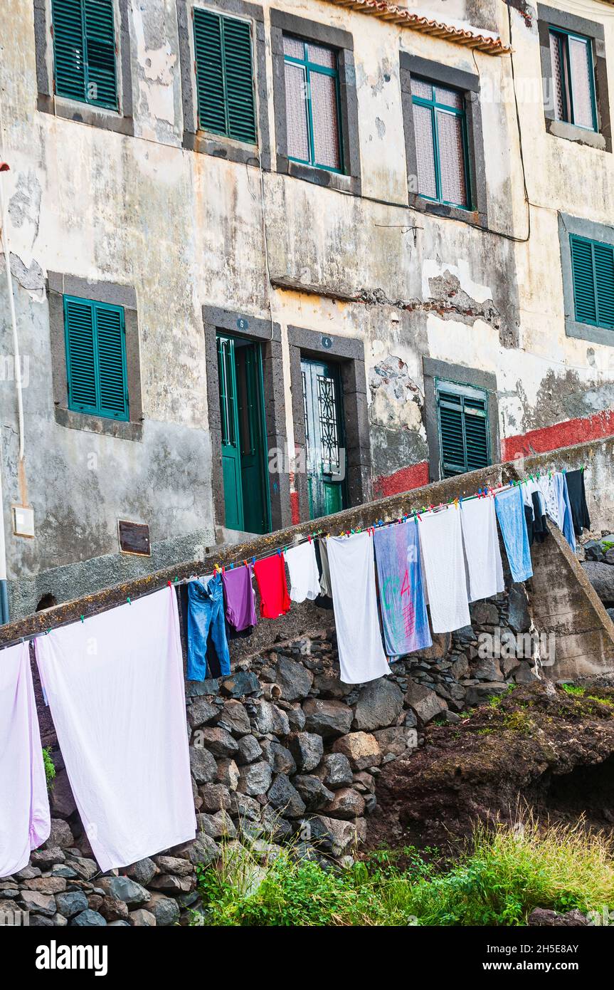Clothes hanging out to dry on a house wall, Madeira Stock Photo - Alamy