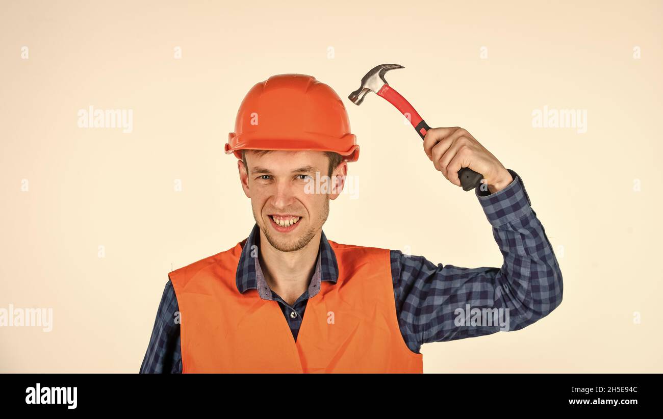 Man repair master knoking own head claw hammer, blockhead concept Stock ...