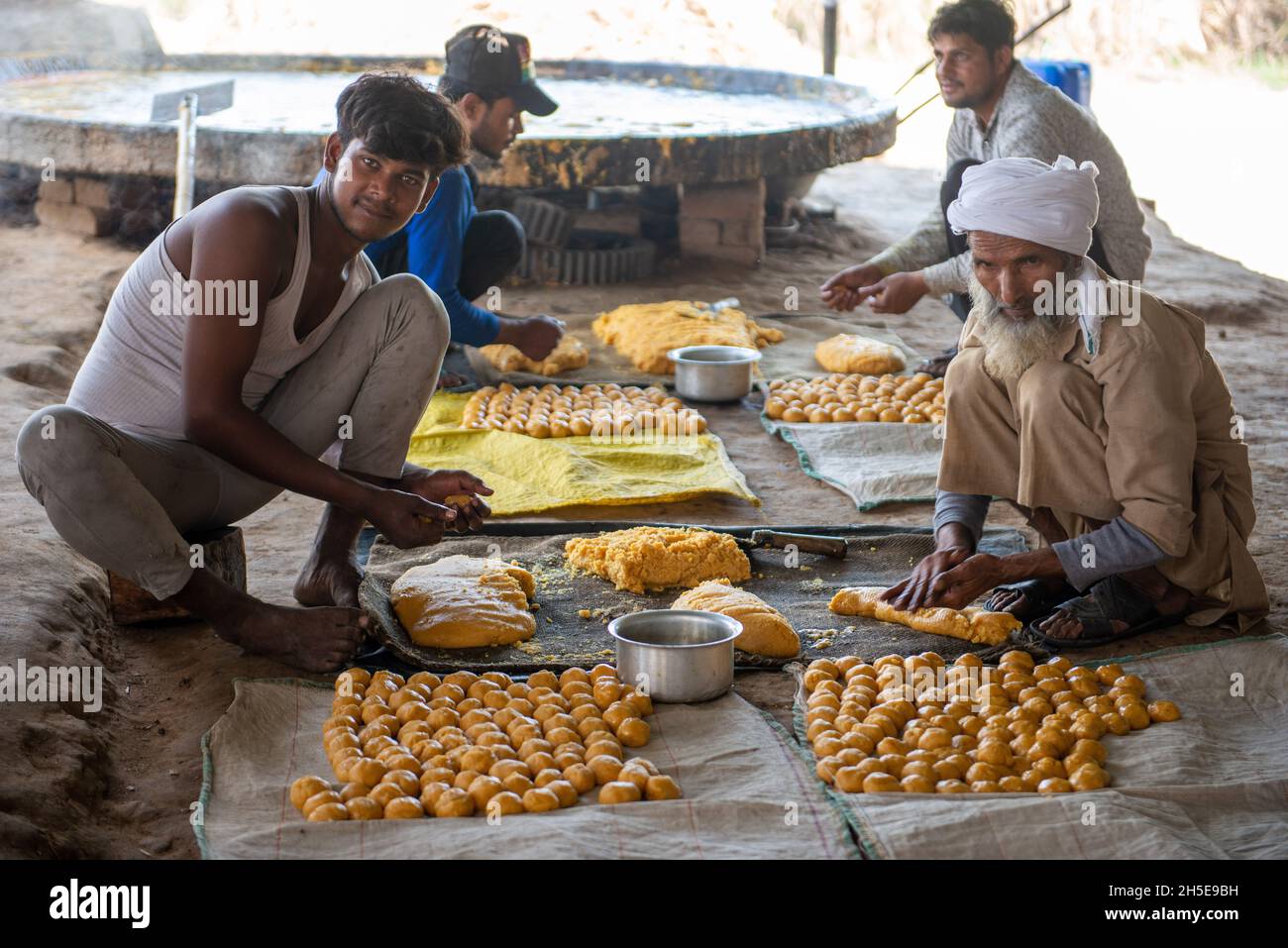 Roorkee, uttarakhand, India- Nov 7 2021: worker making fresh jaggery ...