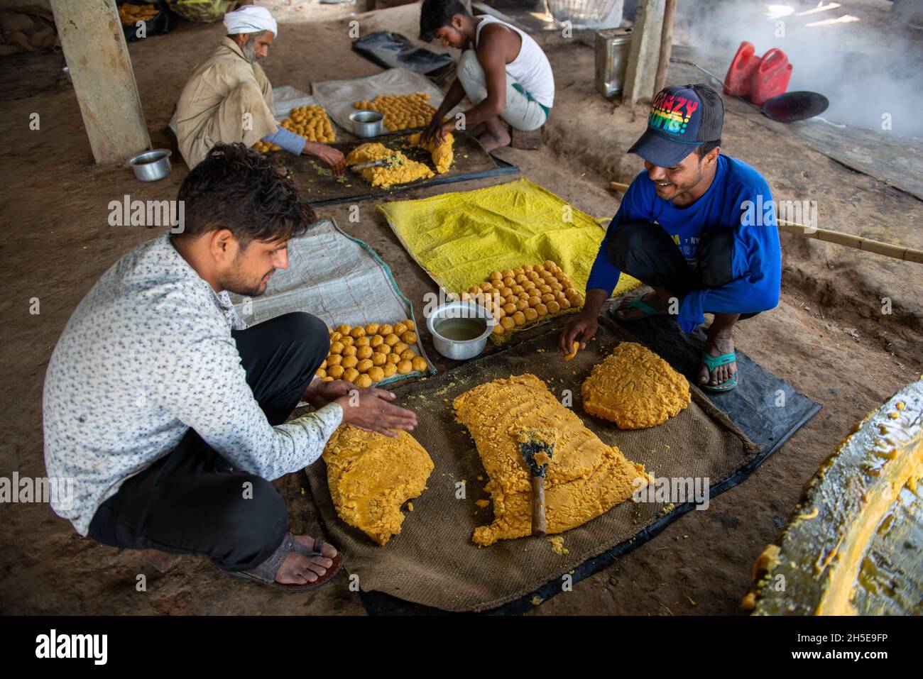 Roorkee, uttarakhand, India- Nov 7 2021: worker making fresh jaggery ...