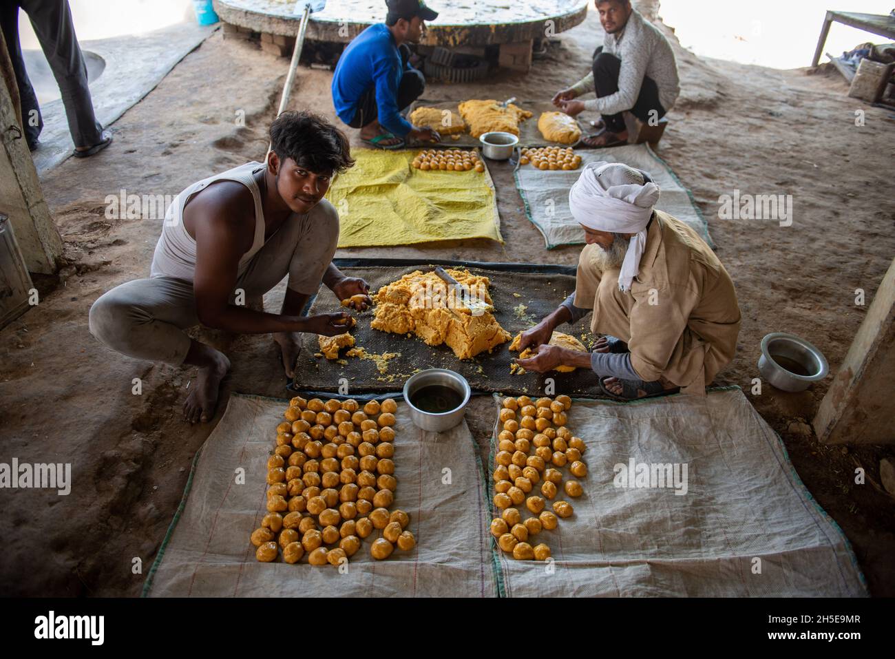Roorkee, uttarakhand, India- Nov 7 2021: worker making fresh jaggery ...