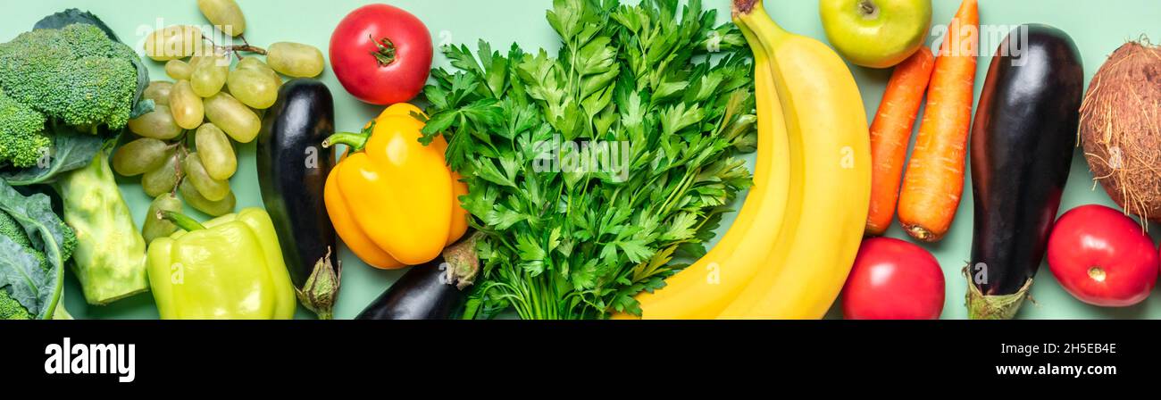 tabletop arrangement of variety of fresh fruits and vegetables sorted ...