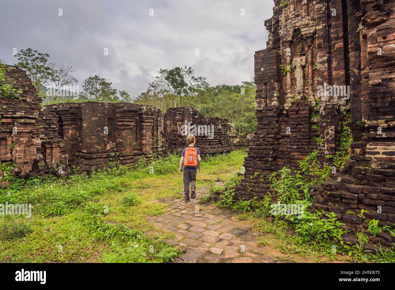 Boy tourist in Temple ruin of the My Son complex, Vietnam. Vietnam ...