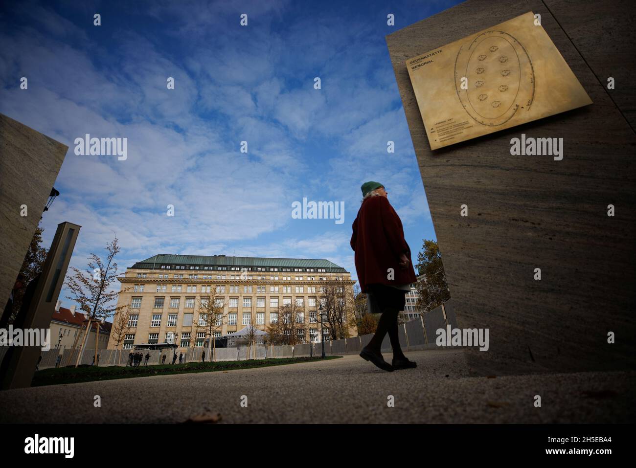 A woman enters the Shoah Wall of Names Memorial bearing the names of ...