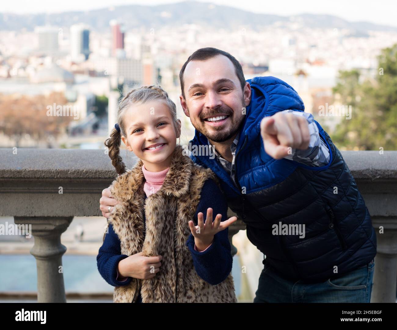 Family looking at sight during sightseeing tour Stock Photo - Alamy