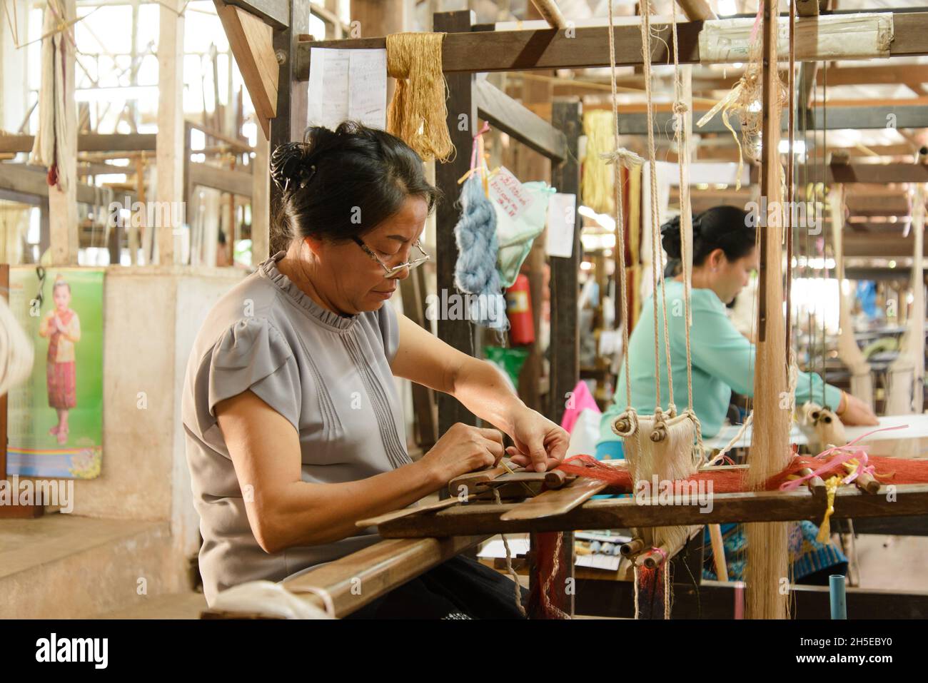 Vientiane, Laos - 14th February 2018: Weavers at work using traditional ...