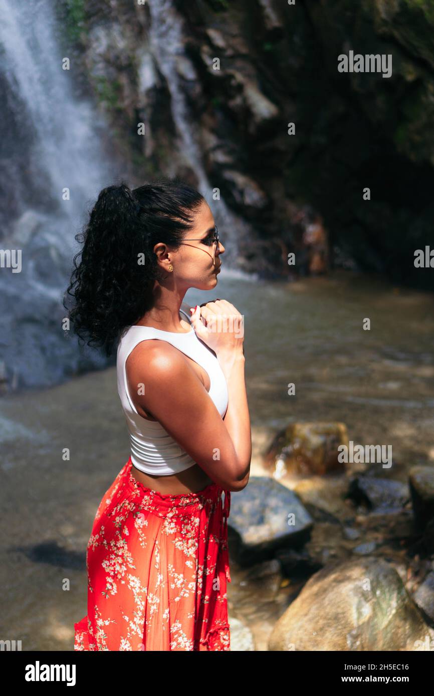 Latin Woman by the river in nature. Vacation and Tourism Concept Stock ...