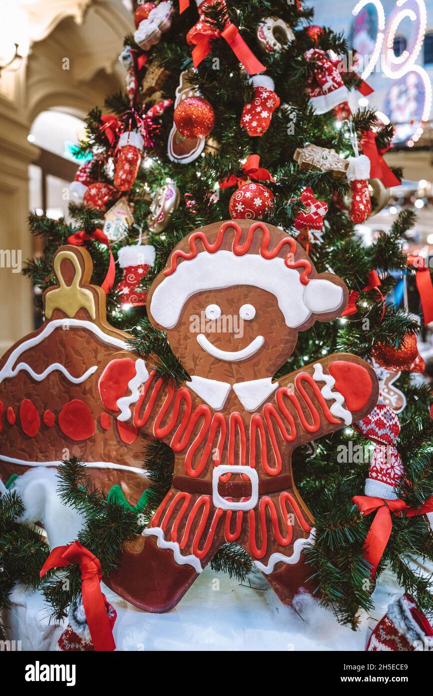 Christmas toy gingerbread man hanging on the branches of a Christmas ...