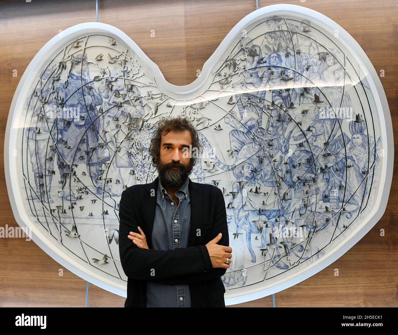 Italian artist Pietro Ruffo poses near his picturial work â Migration ...