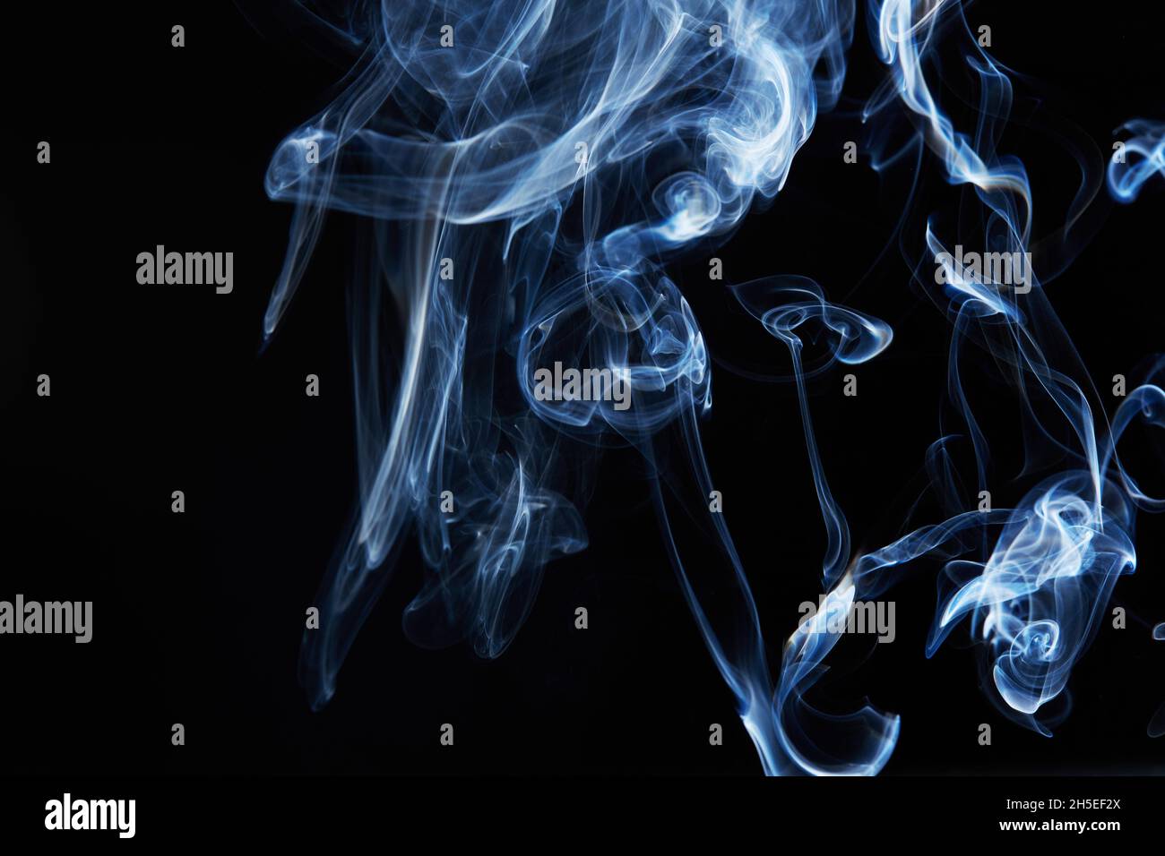 blue smoke on black background with abstract blur motion wave swirl ...