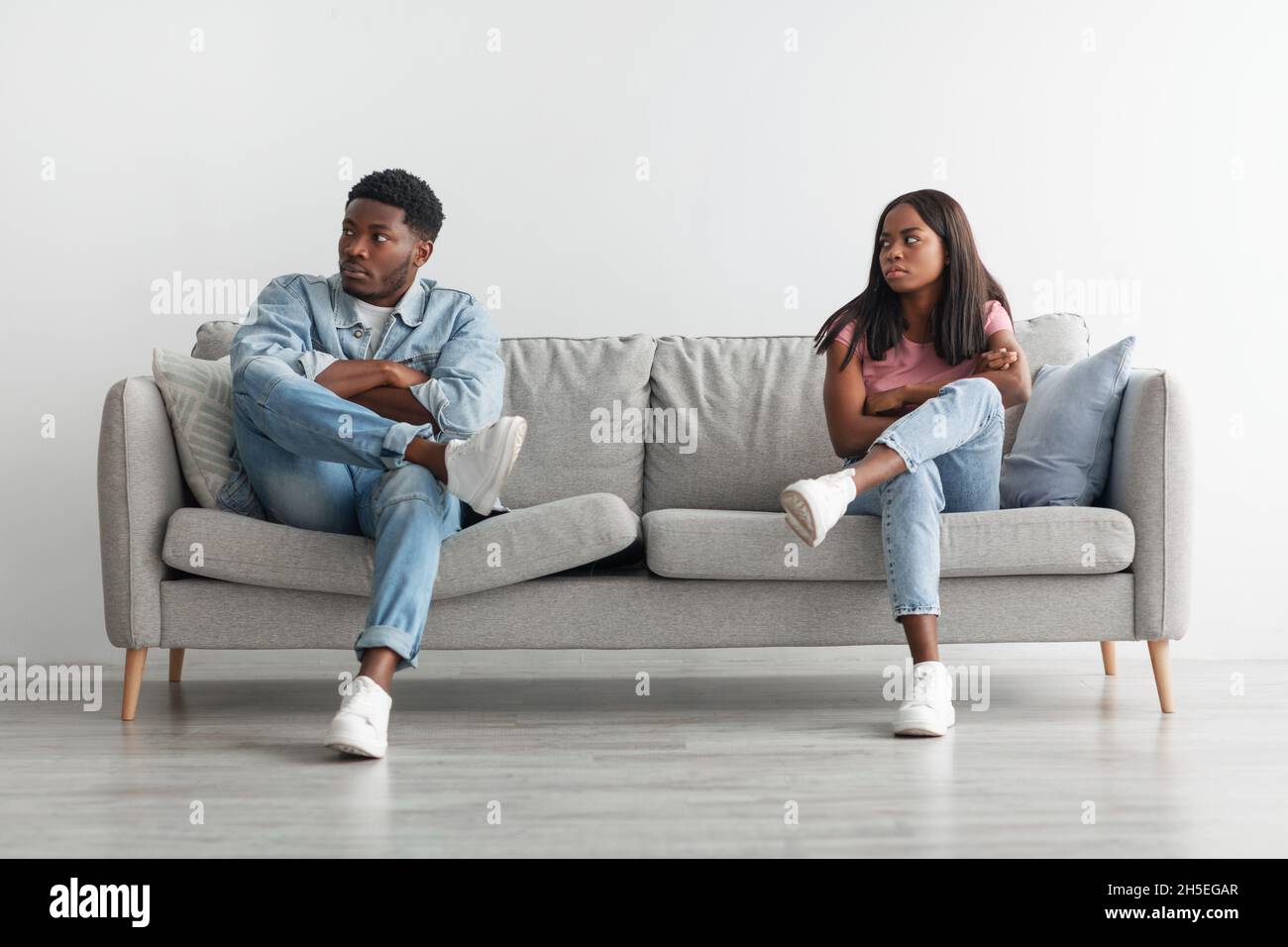 Young black couple having fight, ignoring each other Stock Photo - Alamy
