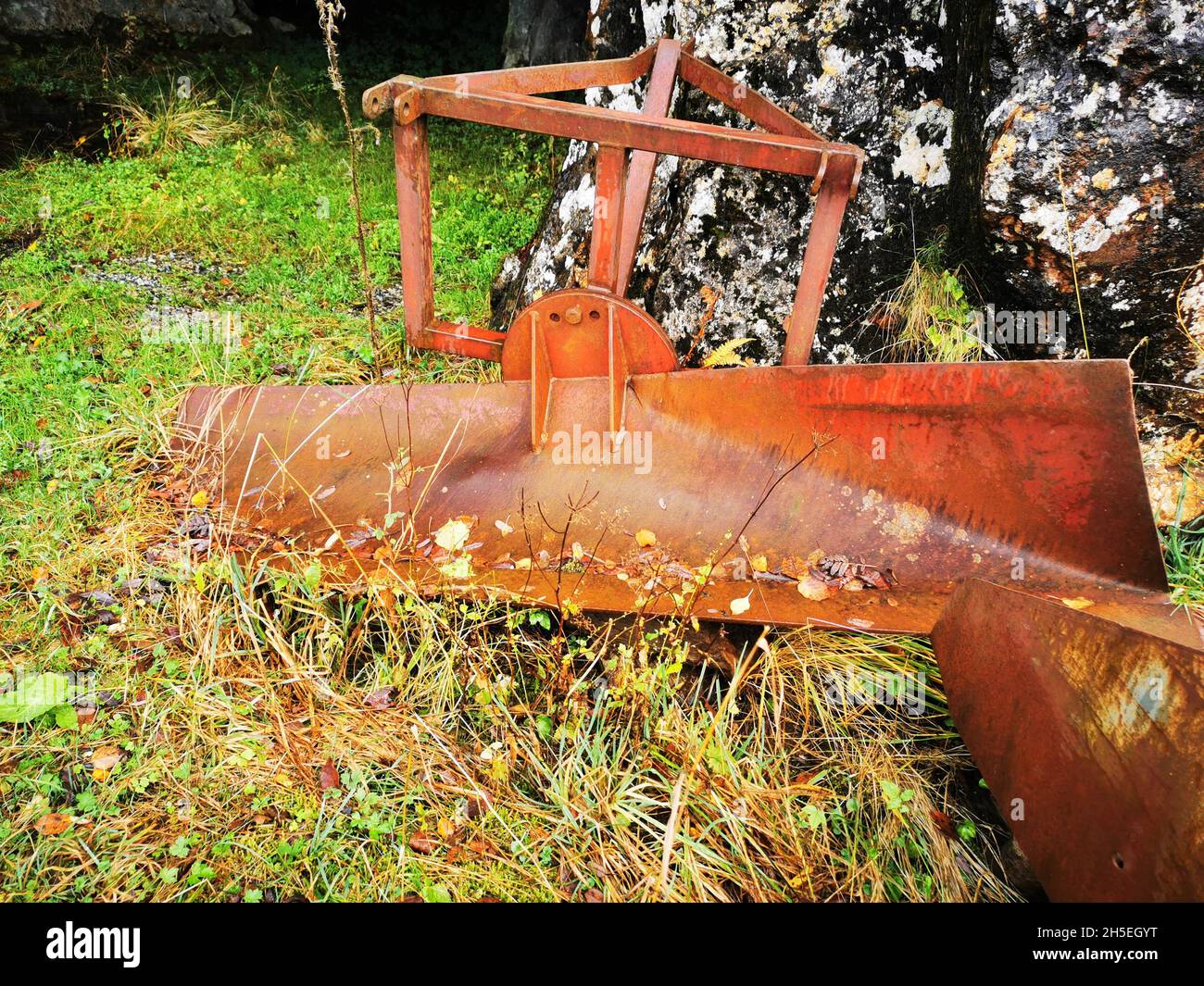Piece of rusty, old equipment used in construction in the woods Stock ...