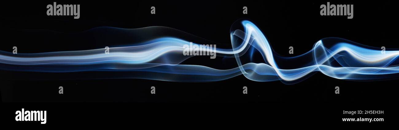 blue smoke on black background with abstract blur motion wave swirl ...