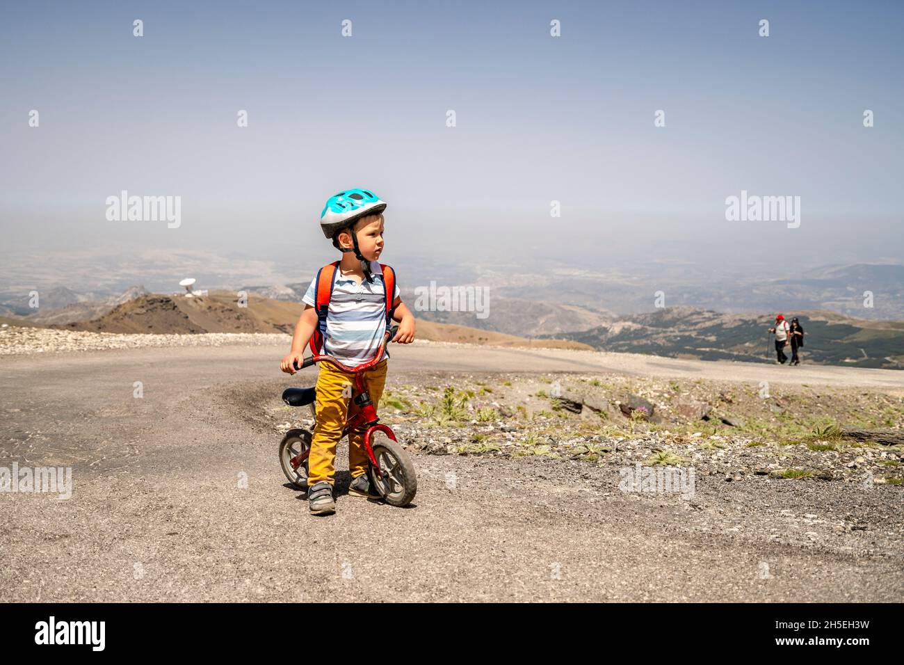 Person riding bike uphill hi-res stock photography and images - Alamy