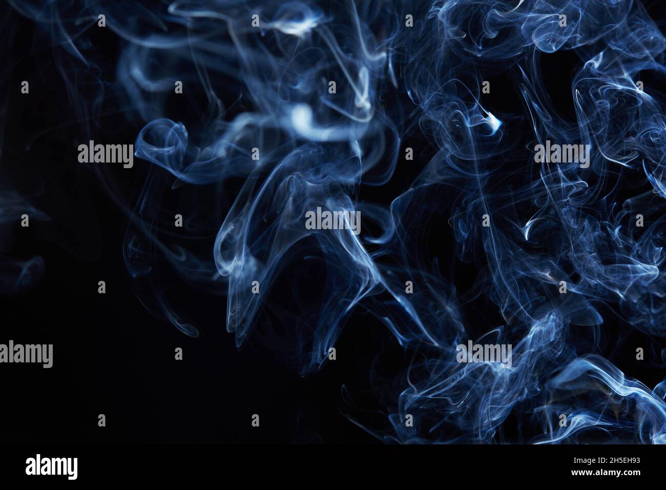 blue smoke on black background with abstract blur motion wave swirl ...