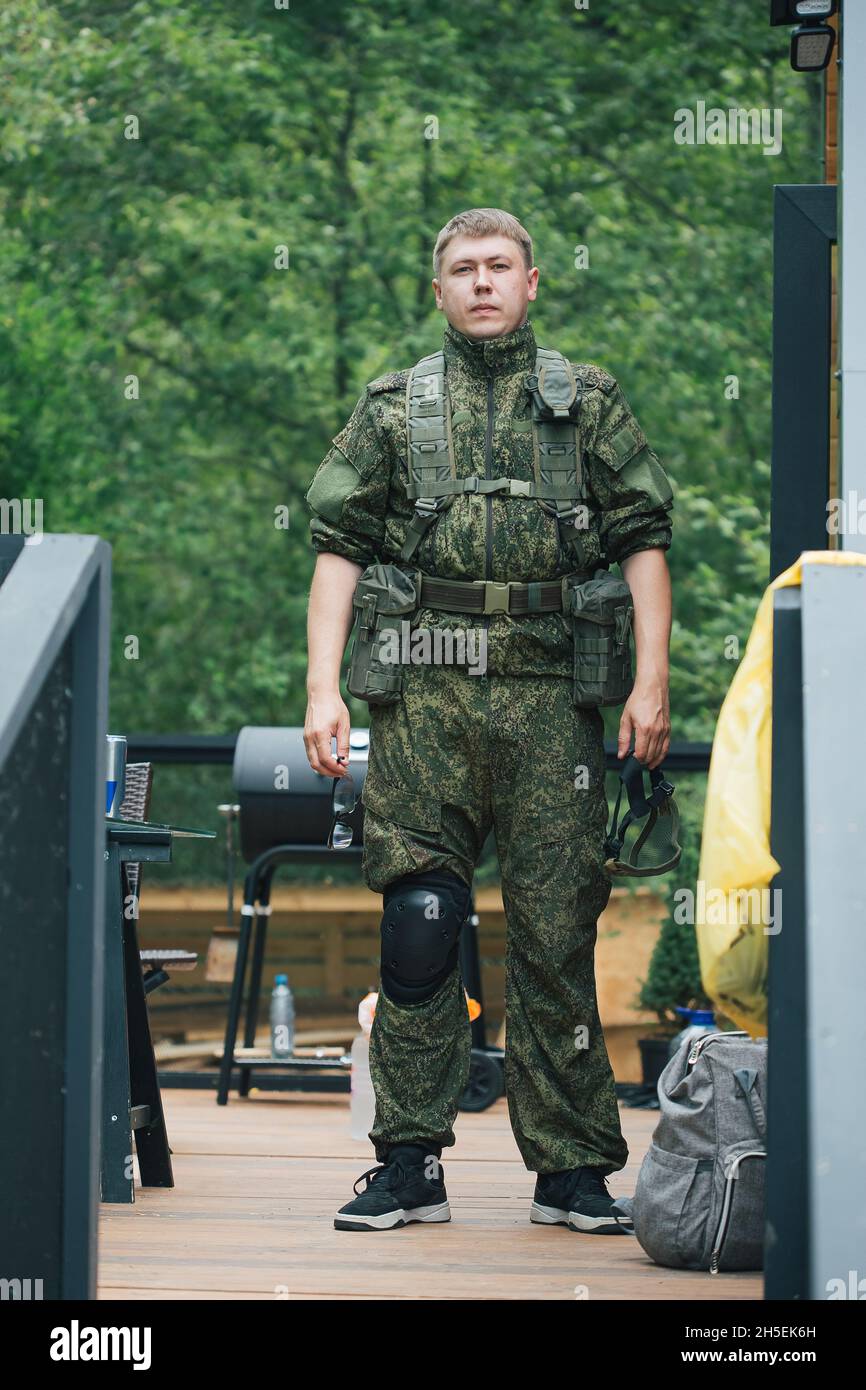 Fully equipped military men with automatic weapons getting ready to ...