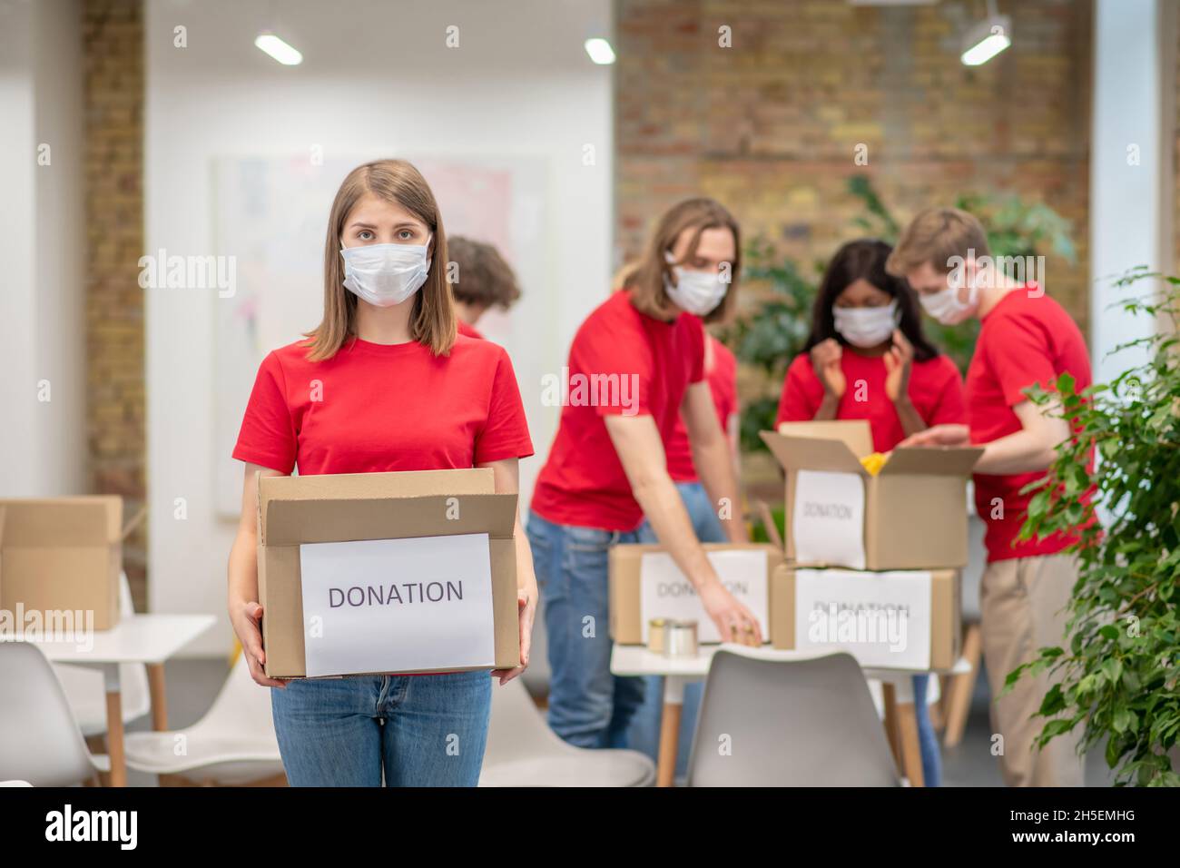 Volunteers sorting donations hi-res stock photography and images - Alamy