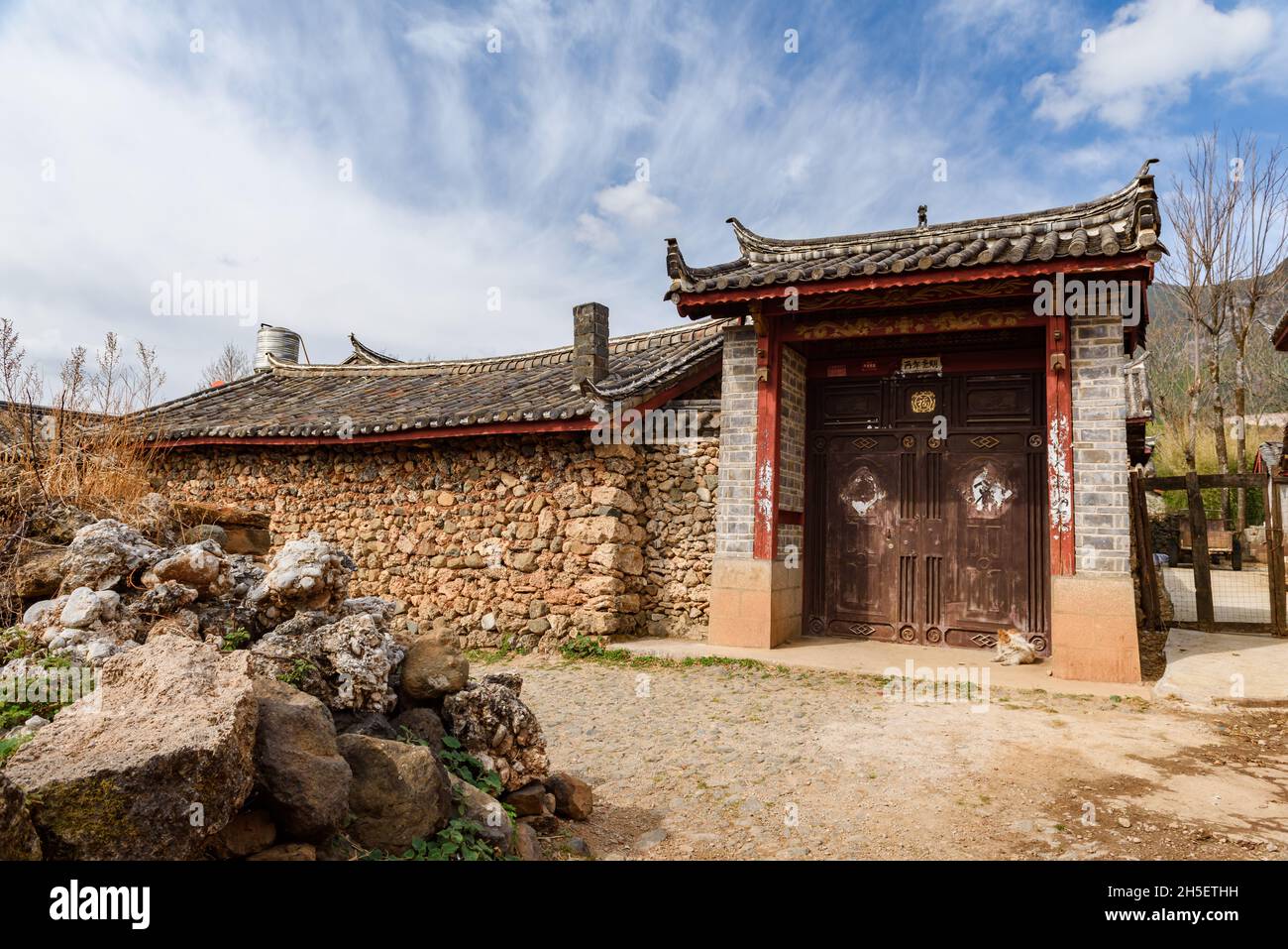 Yunnan, China - 24 March 2016: Typical old farm house in rural Lijiang ...