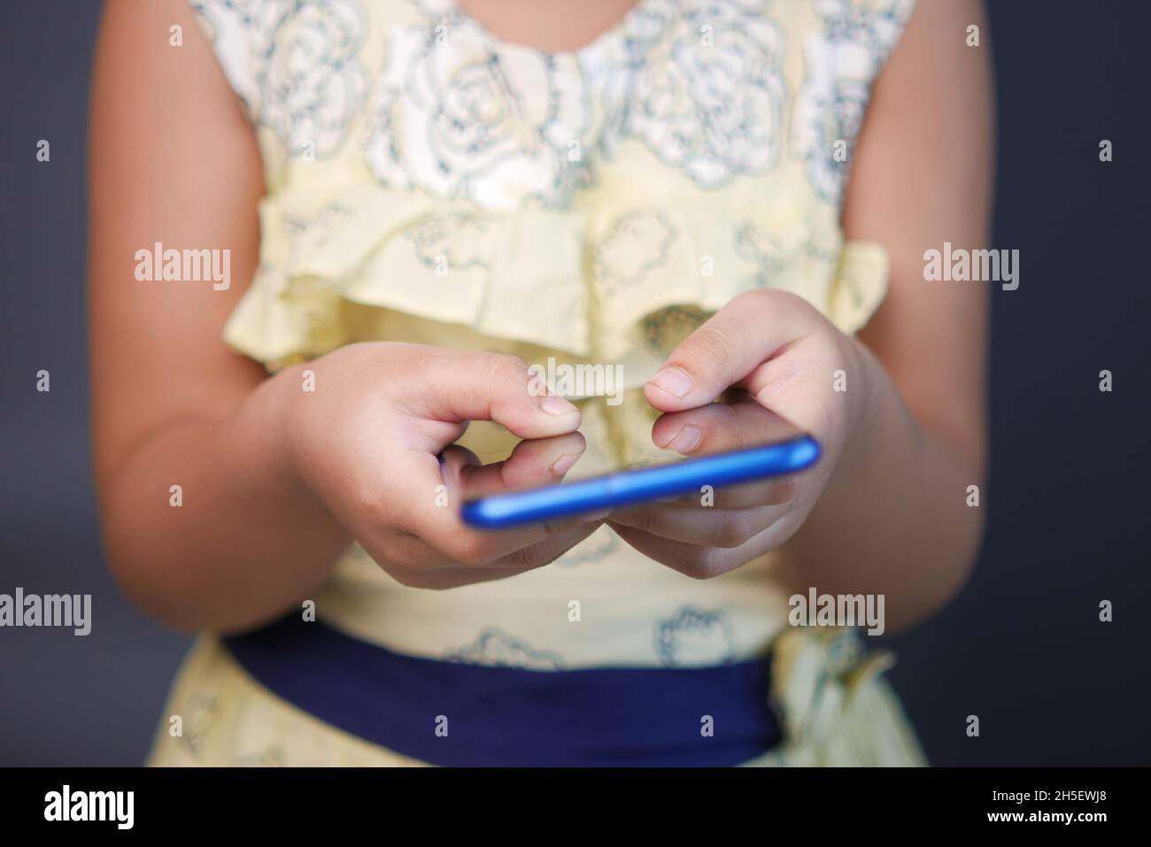 child hand pointing finger on smart phone screen Stock Photo - Alamy