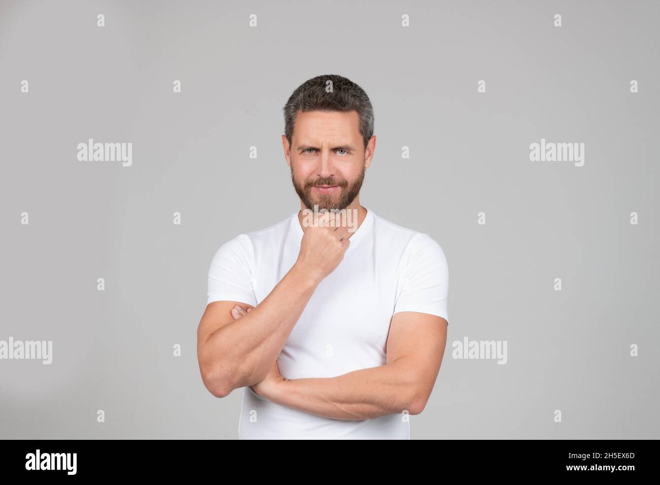 I am what I think. Thoughtful man grey background. Serious guy think ...