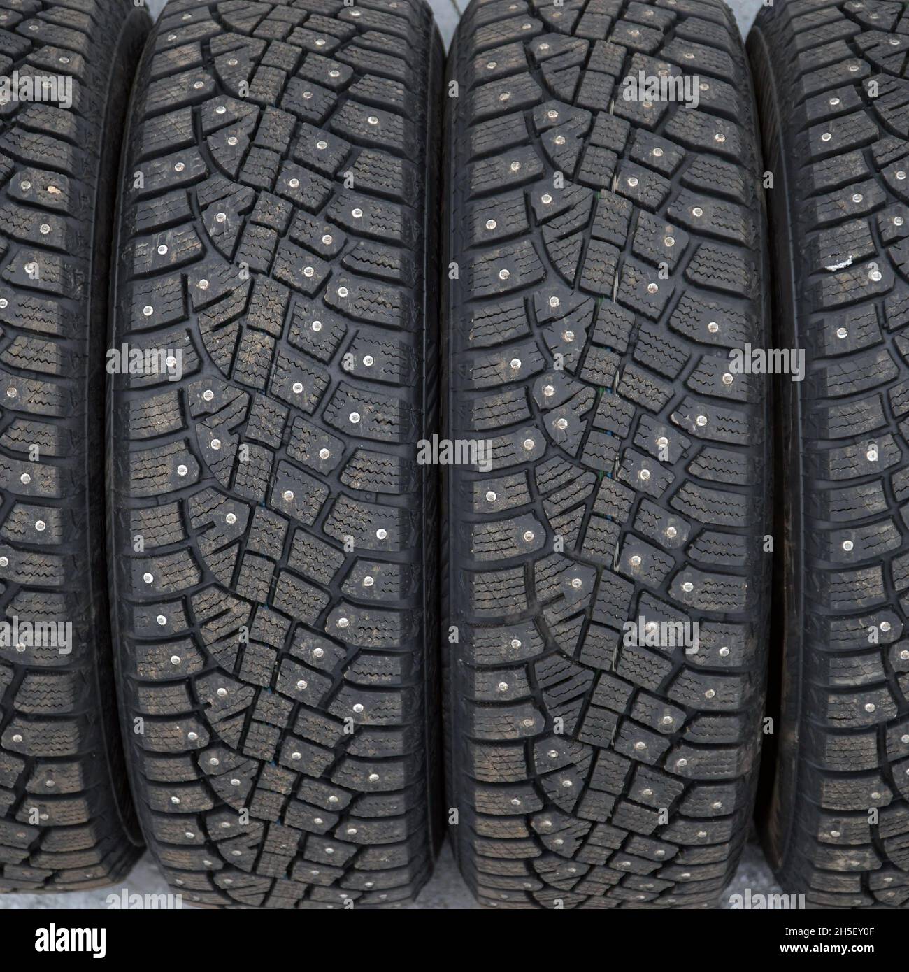 Winter studded tires for safe driving Stock Photo - Alamy