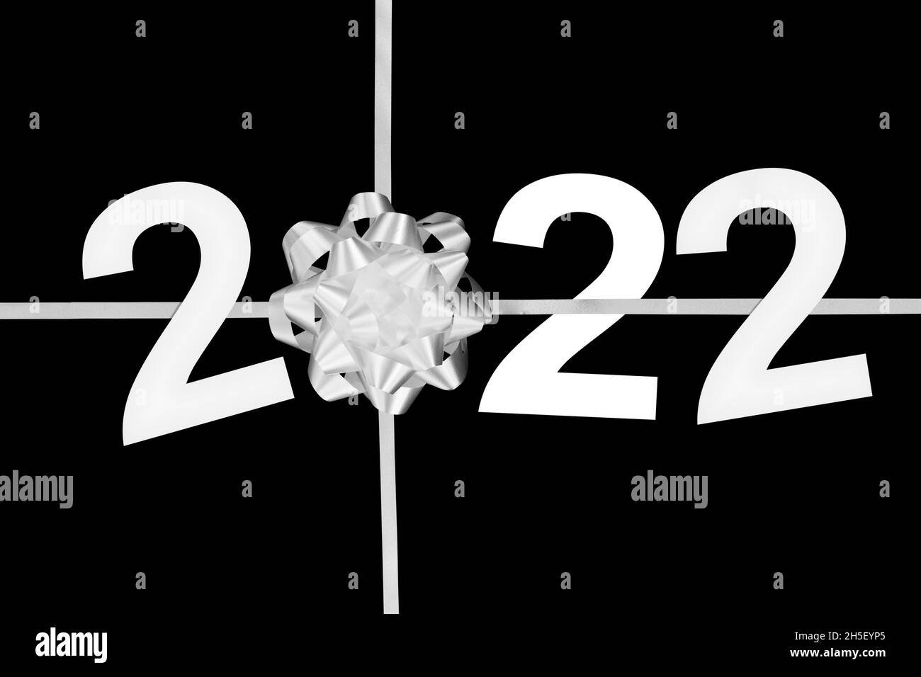 2022 white gift bow and ribbon isolated on black background Stock Photo ...