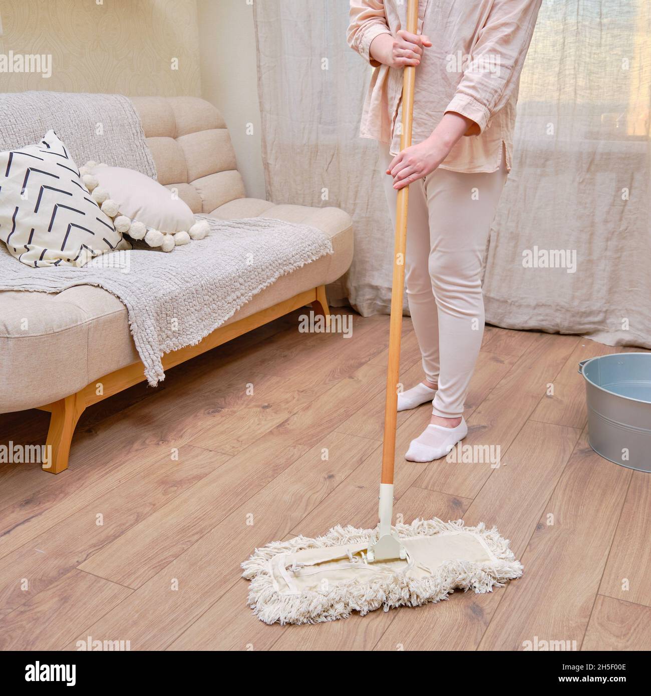 Woman mops the floor hi-res stock photography and images - Alamy