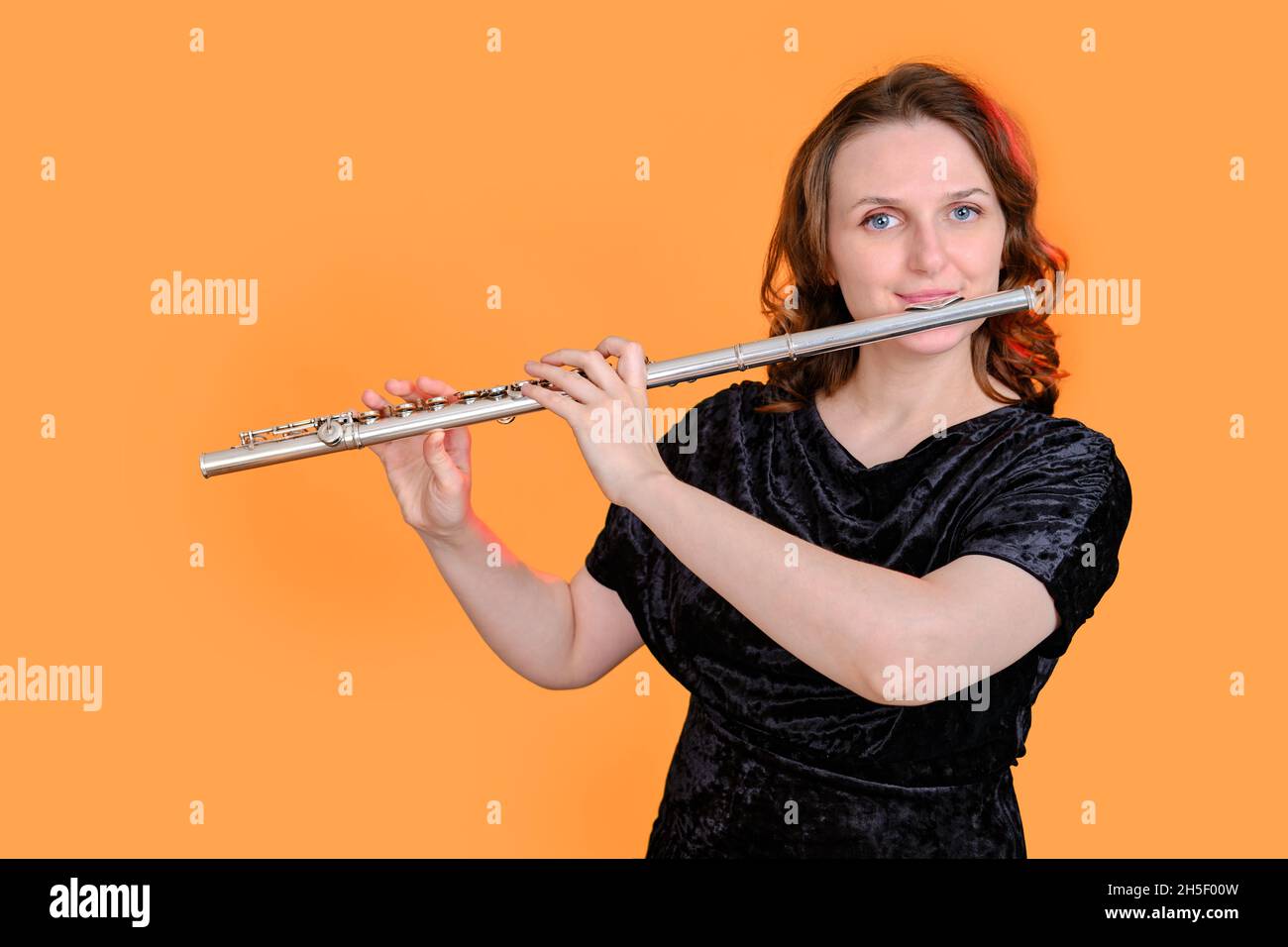 Professional female flutist in concert hi-res stock photography and ...
