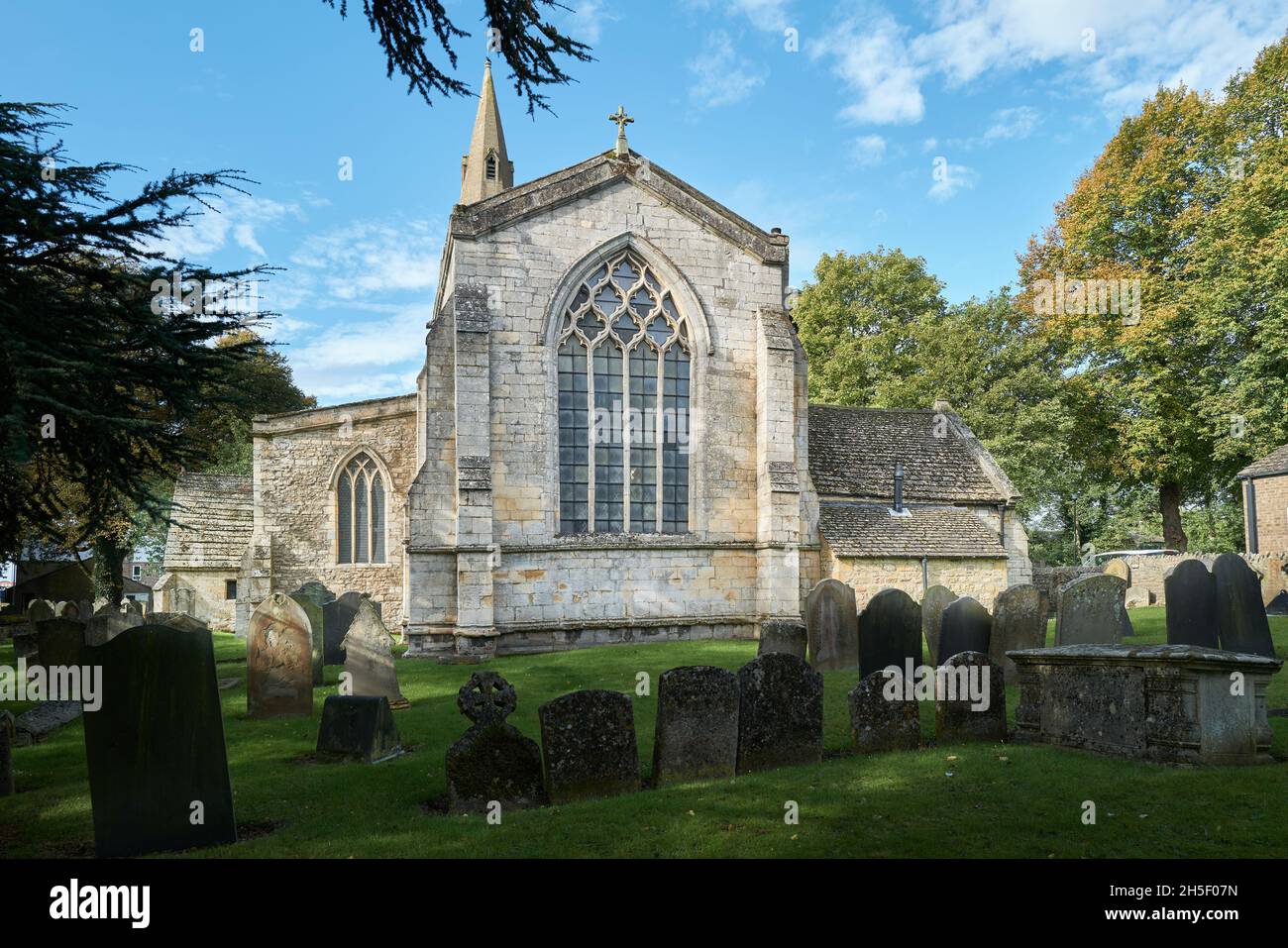 The east end of the christian church of St John, Corby, England Stock ...