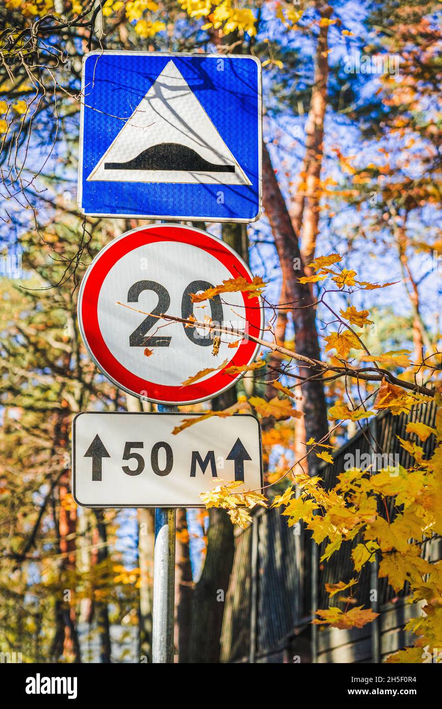 Warning road signs on country road. Speed Limit concept Stock Photo - Alamy