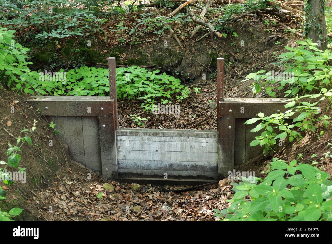 Small gated weir for groundwater infiltration Stock Photo - Alamy