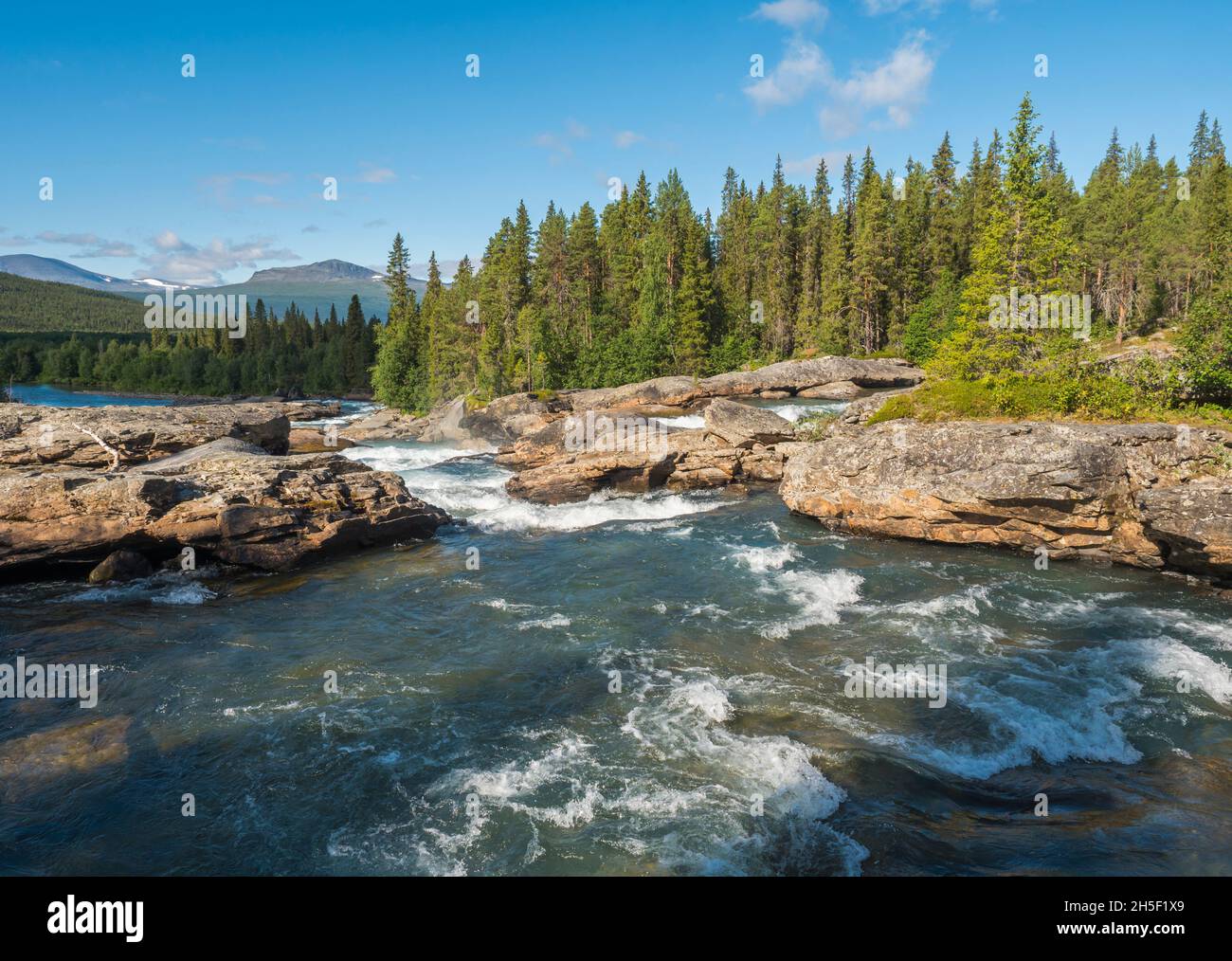 Beautiful northern landscape with rapids and cascades of wild river ...