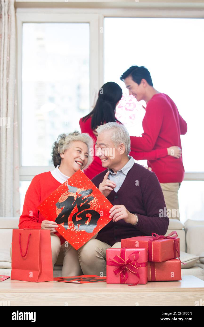 Happy families celebrating the New Year Stock Photo - Alamy