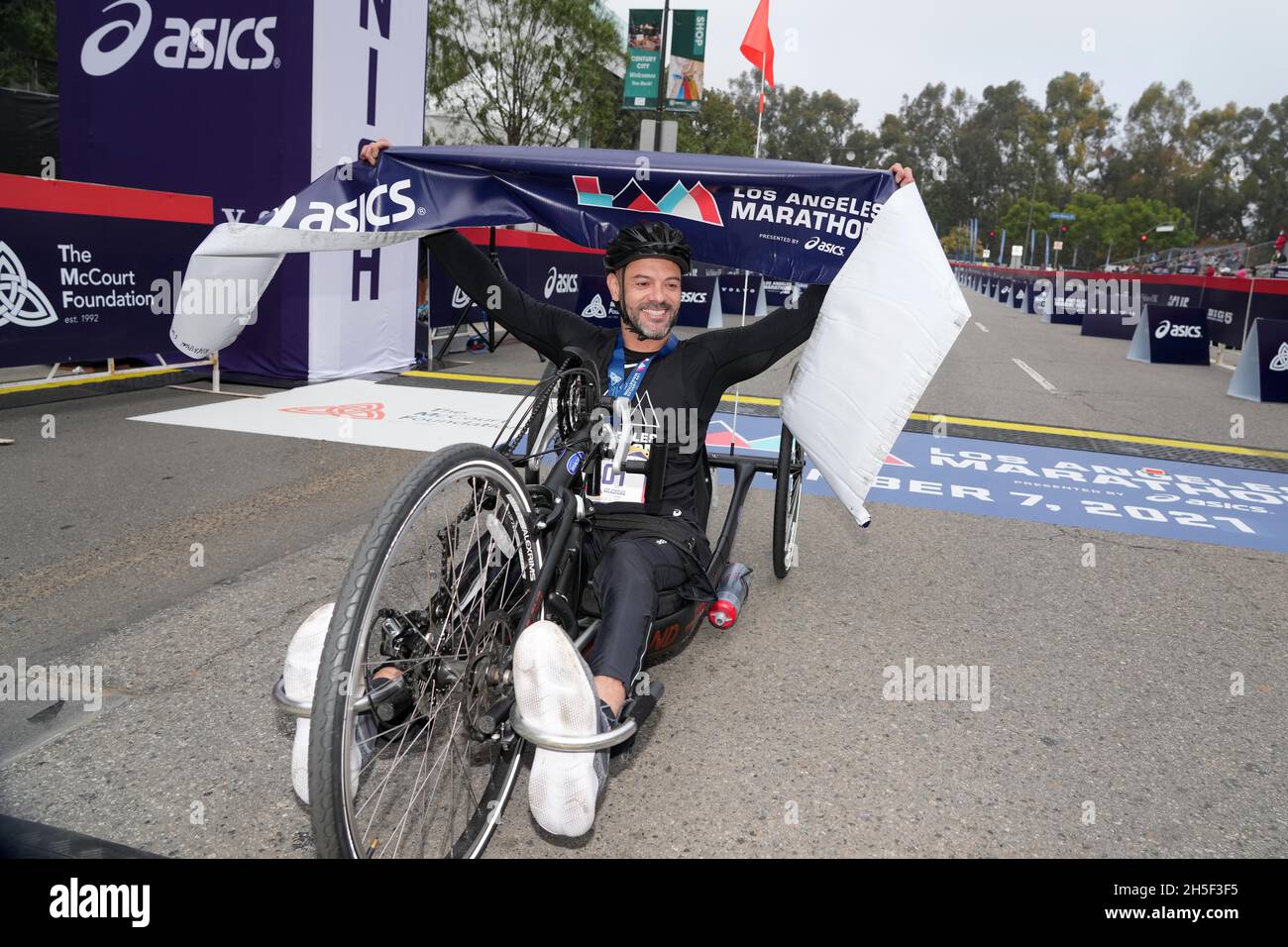 David Rodarte poses after winning the handcycle wheelchair race in 2: ...