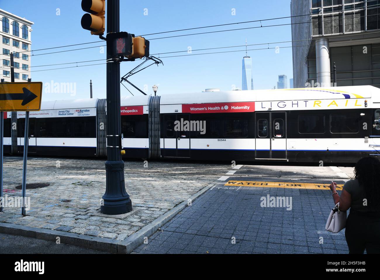 COBBLESTONE WAY: The New Jersey transit light rail train travels down ...