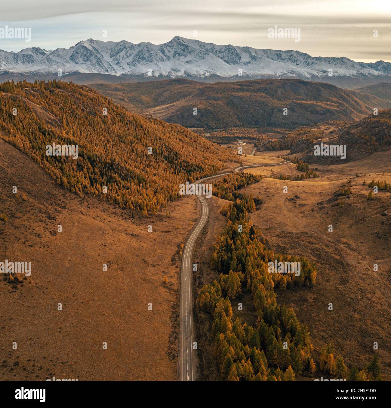 Aerial view of a highway between mountains Stock Photo - Alamy