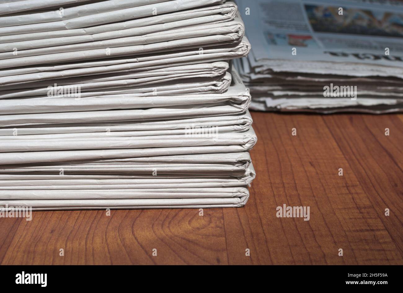 Stack of newspapers Stock Photo - Alamy