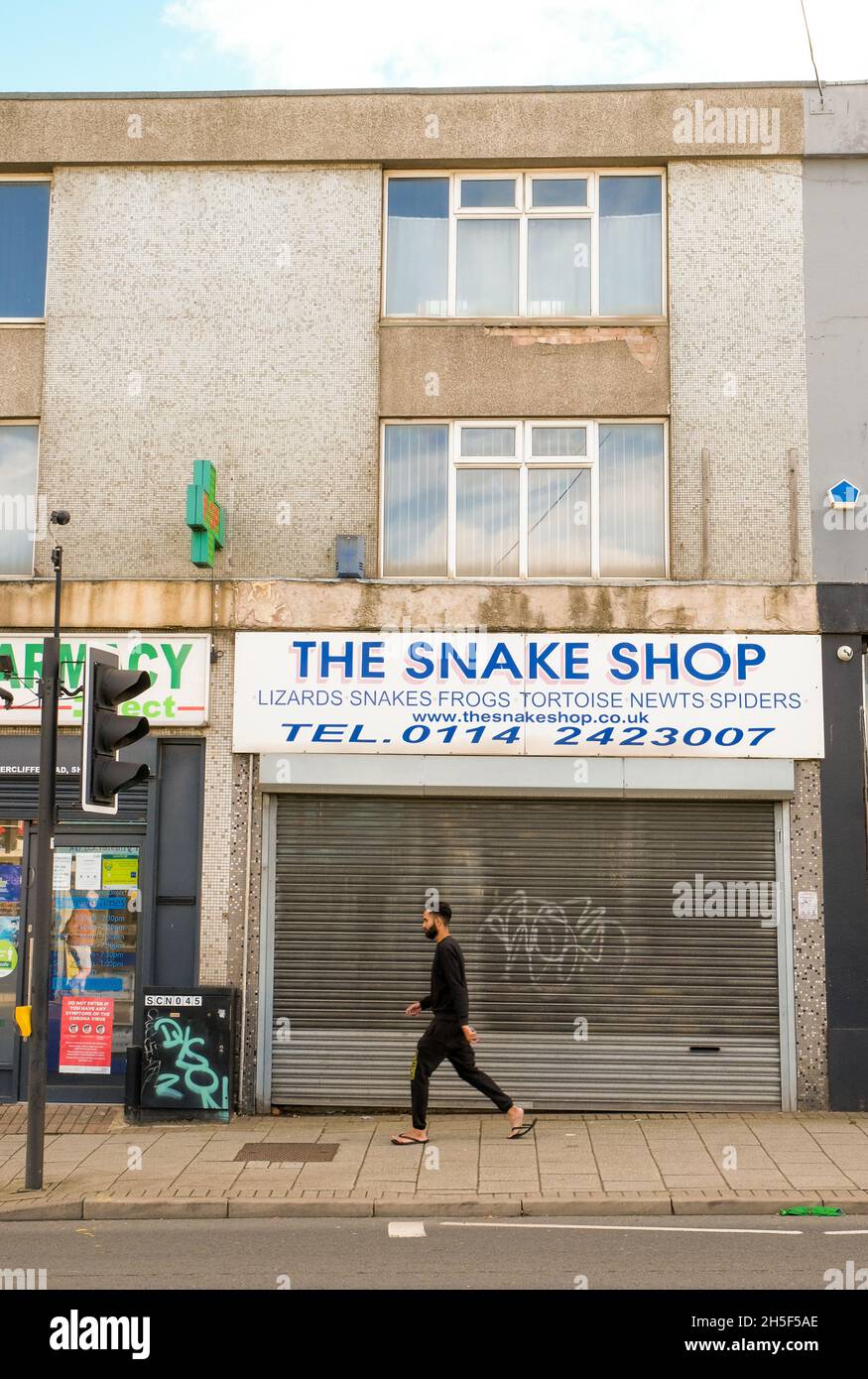 A man passes by The Snake Shop, Sheffield, once a popular source of ...