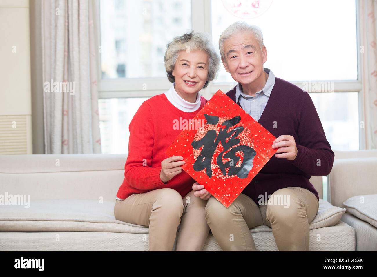 Happy grandma celebrating the New Year Stock Photo - Alamy