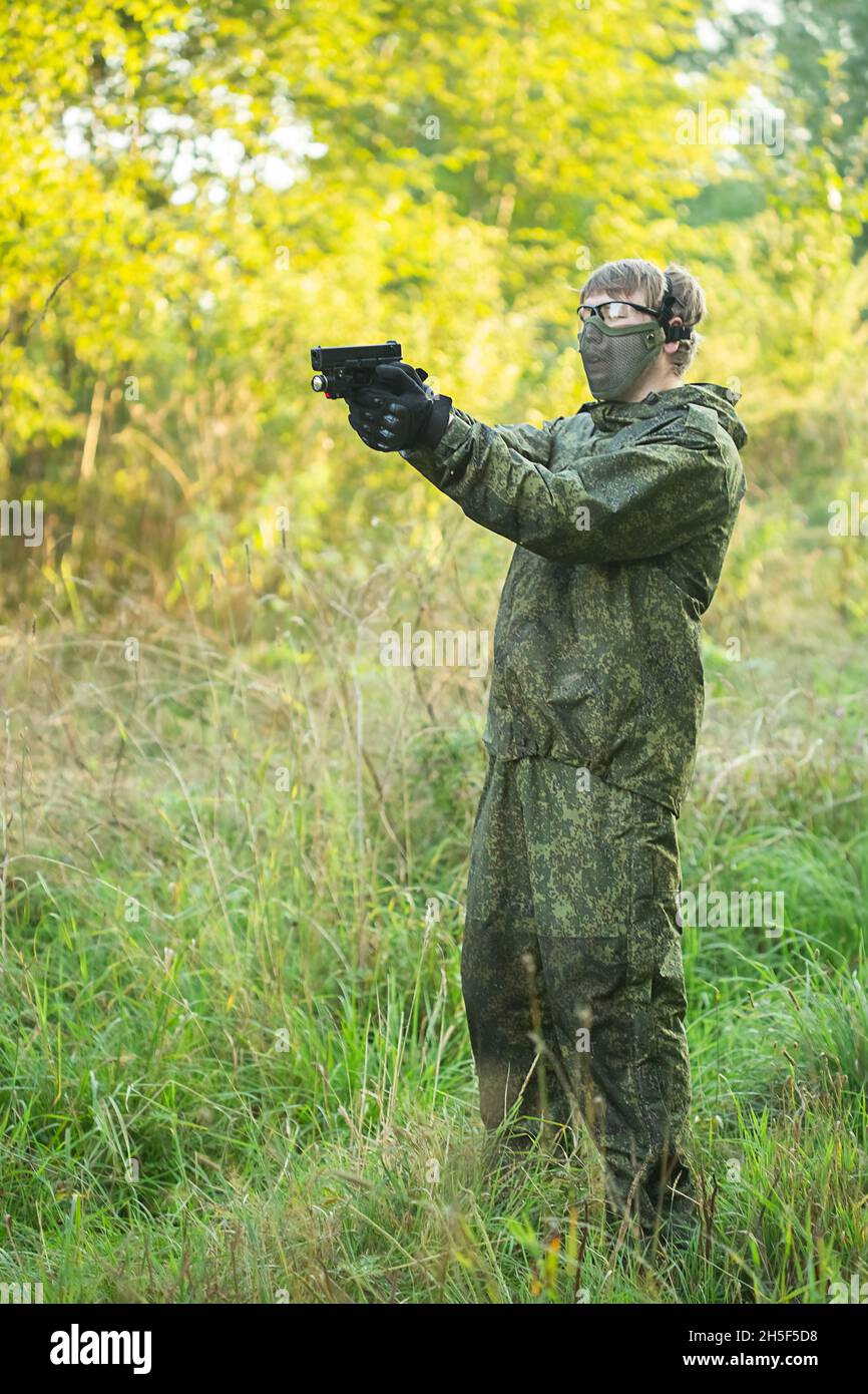 Fully equipped military men with automatic weapons getting ready to ...