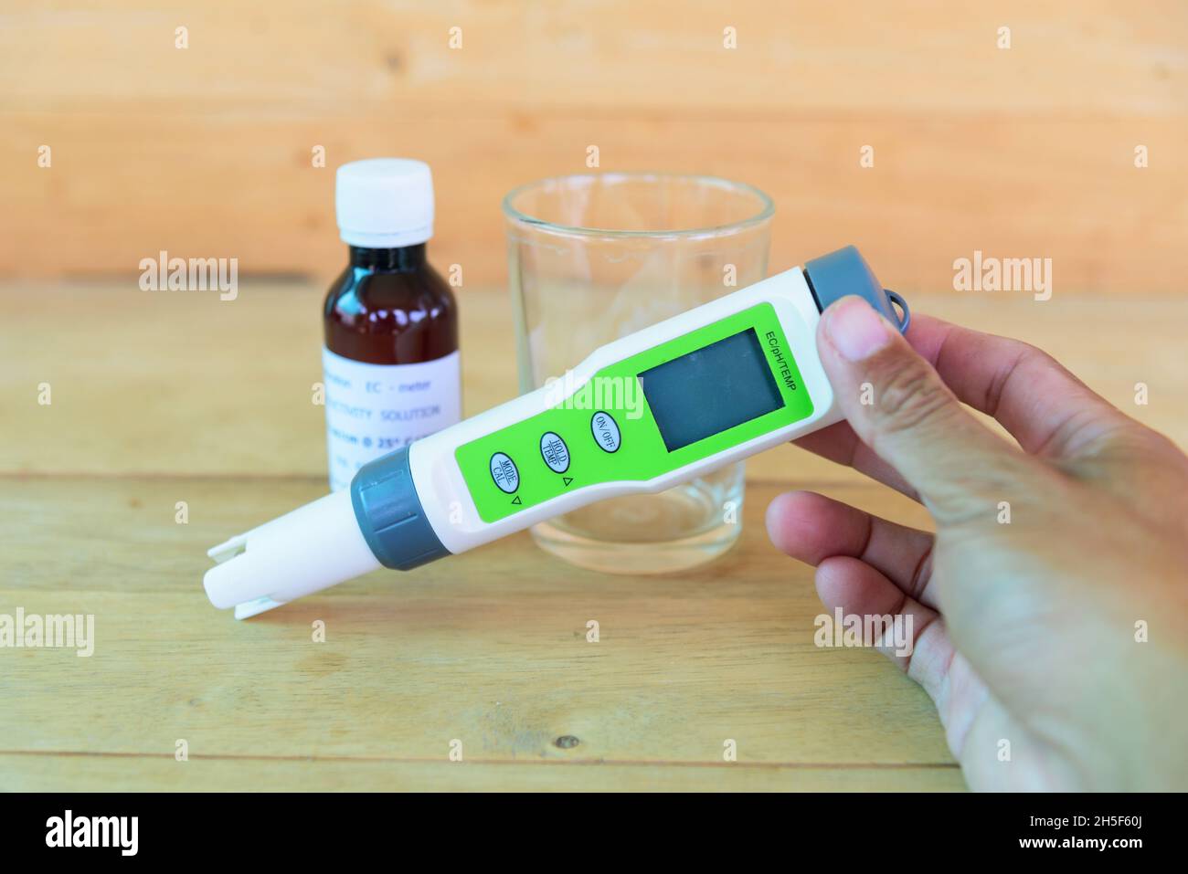 The man calibrate Ph meter before use it for tester Stock Photo - Alamy