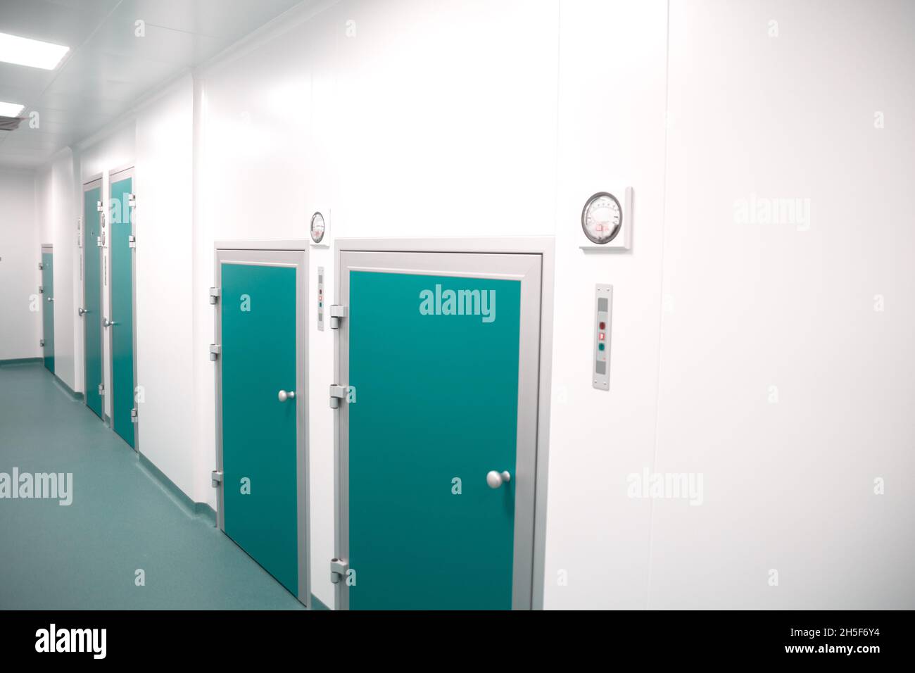 Laboratory corridor with green doors and measuring sensors Stock Photo ...