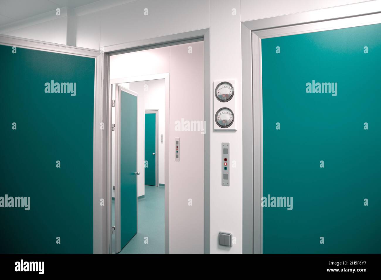 Laboratory corridor with green doors and measuring sensors Stock Photo ...