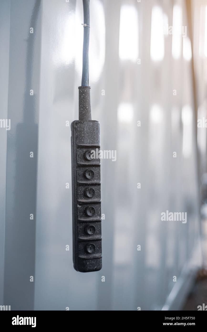 Remote from the industrial crane hanging on the cable Stock Photo - Alamy