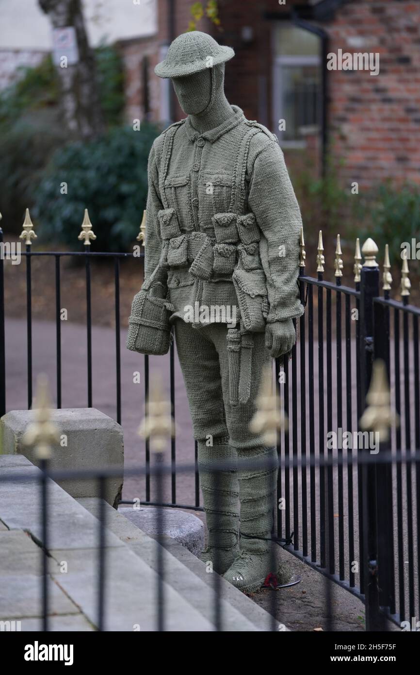 A life-sized knitted soldier has been placed at the War Memorial Clock ...
