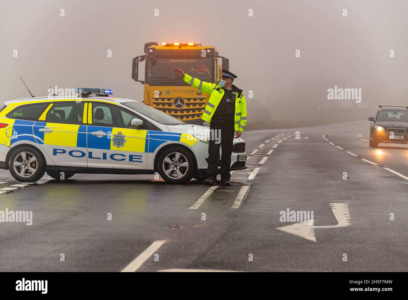 Police close road due to oil spill, UK Britian Stock Photo - Alamy