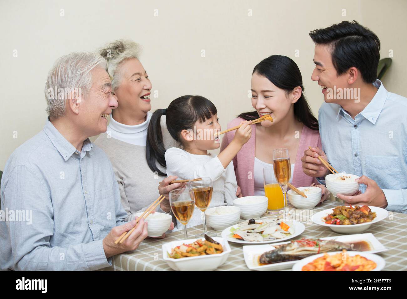 The family having meals happily Stock Photo - Alamy