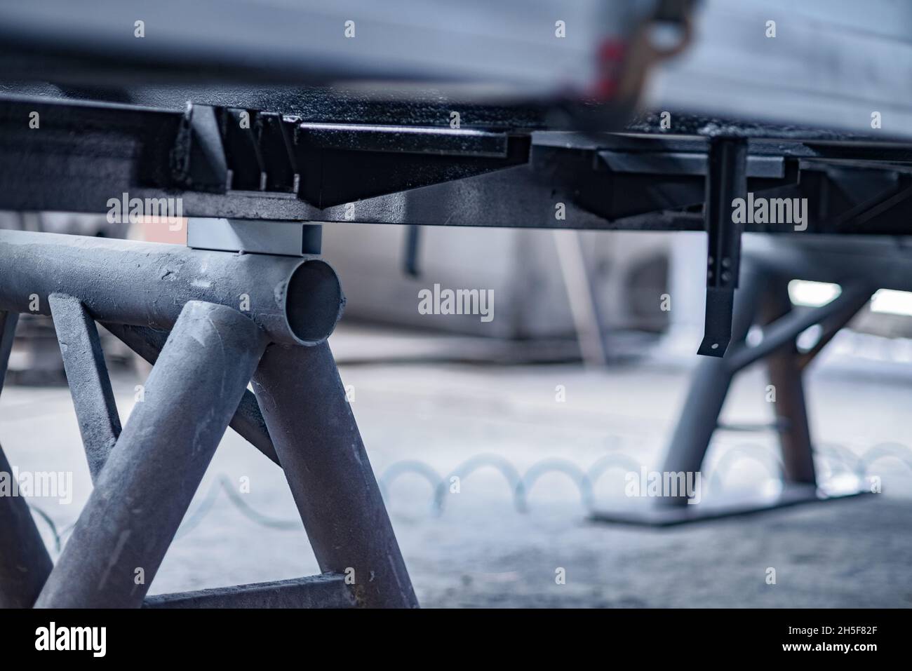 Metal supports made of pipes for heavy construction Stock Photo - Alamy