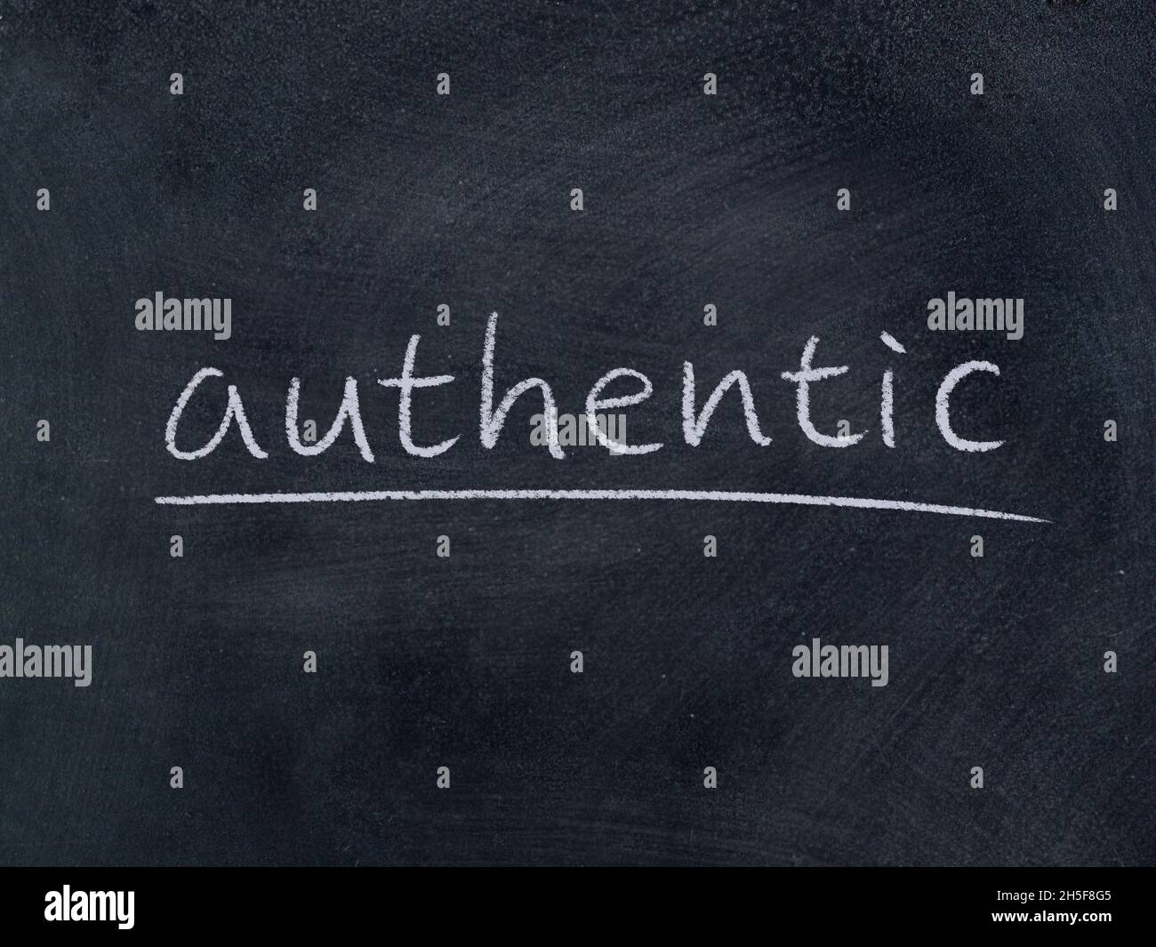 authentic concept word on blackboard background Stock Photo - Alamy